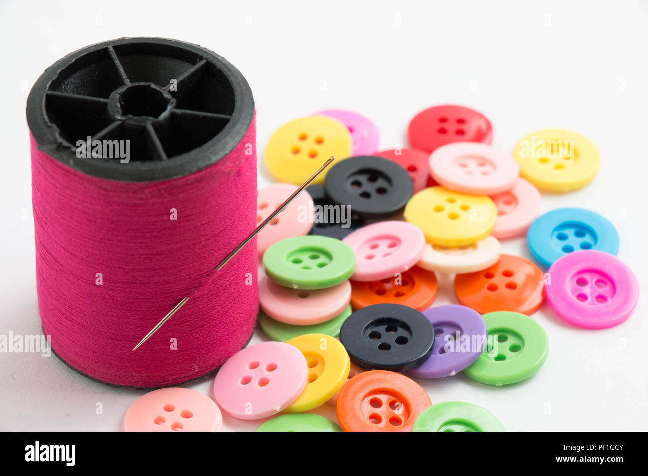 needle with thread/ Spool of thread and buttons, sew instrument ...