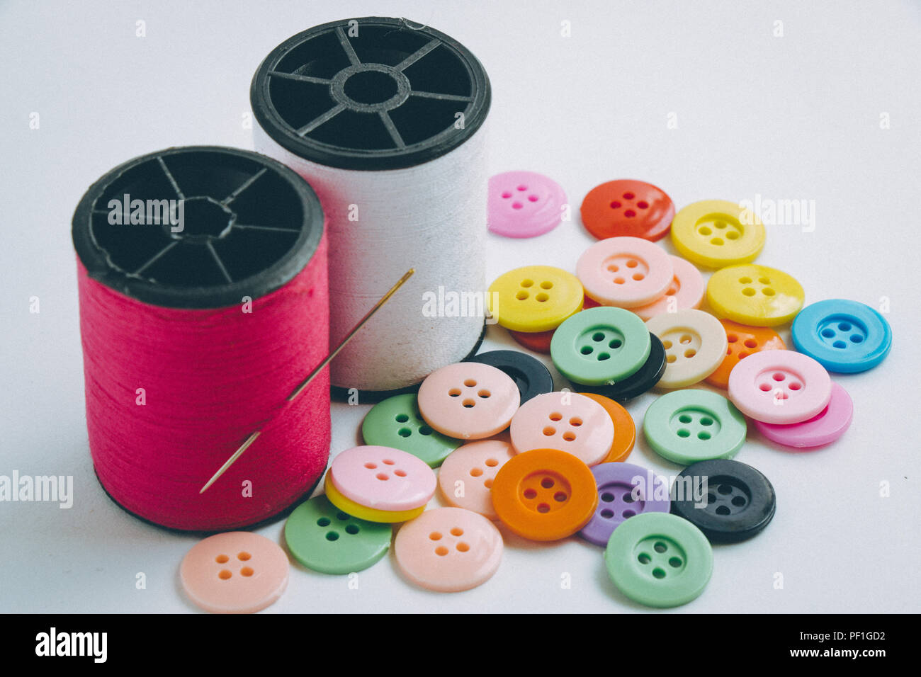 needle with thread/ Spool of thread and buttons, sew instrument ...