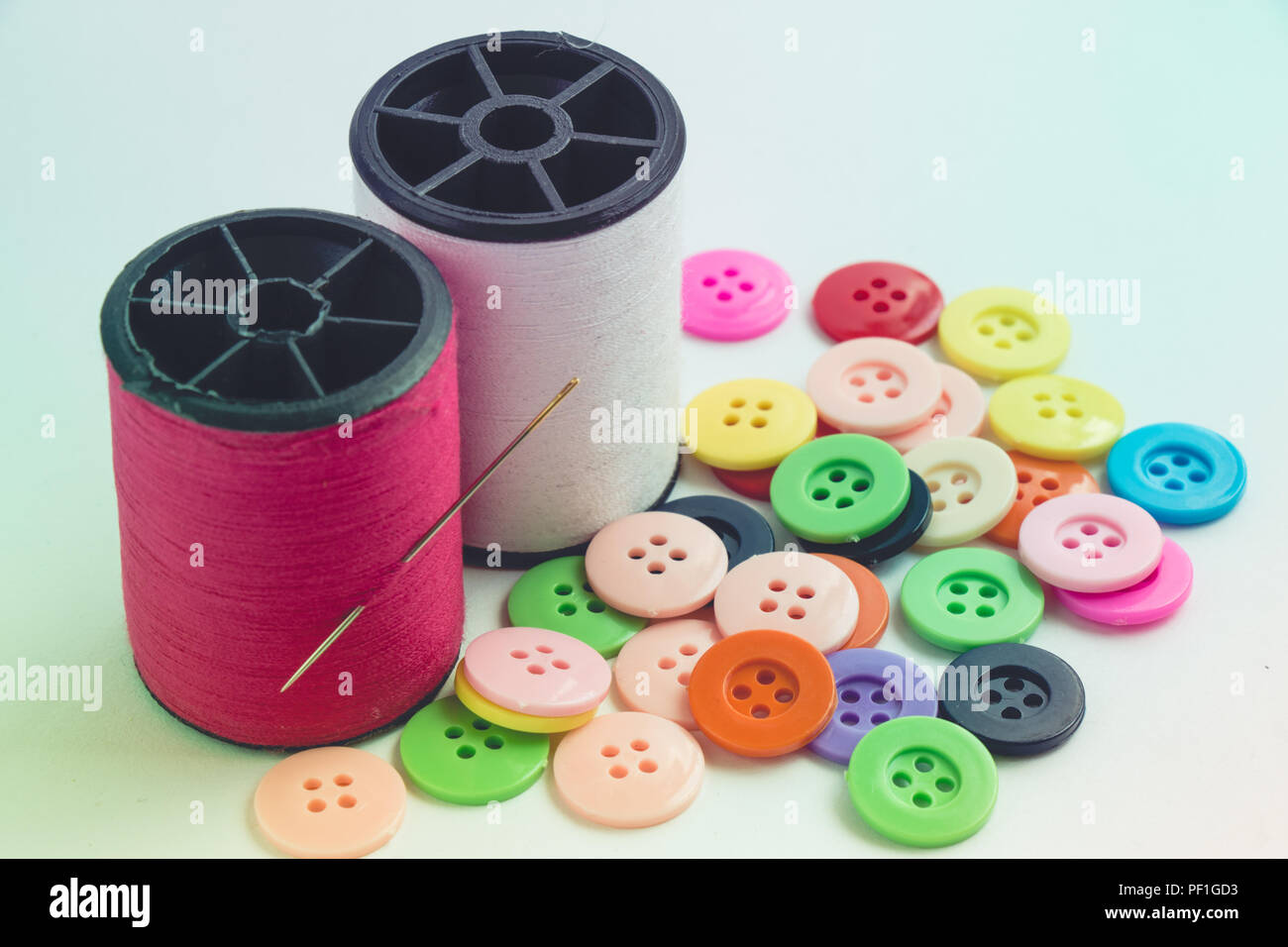 needle with thread/ Spool of thread and buttons, sew instrument ...