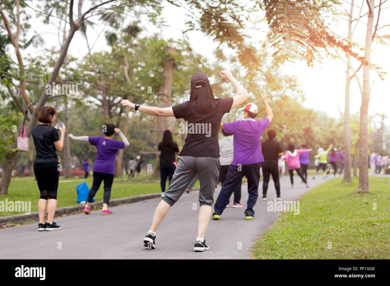 Group of people doing exercise aerobics dancing Stock Photo - Alamy