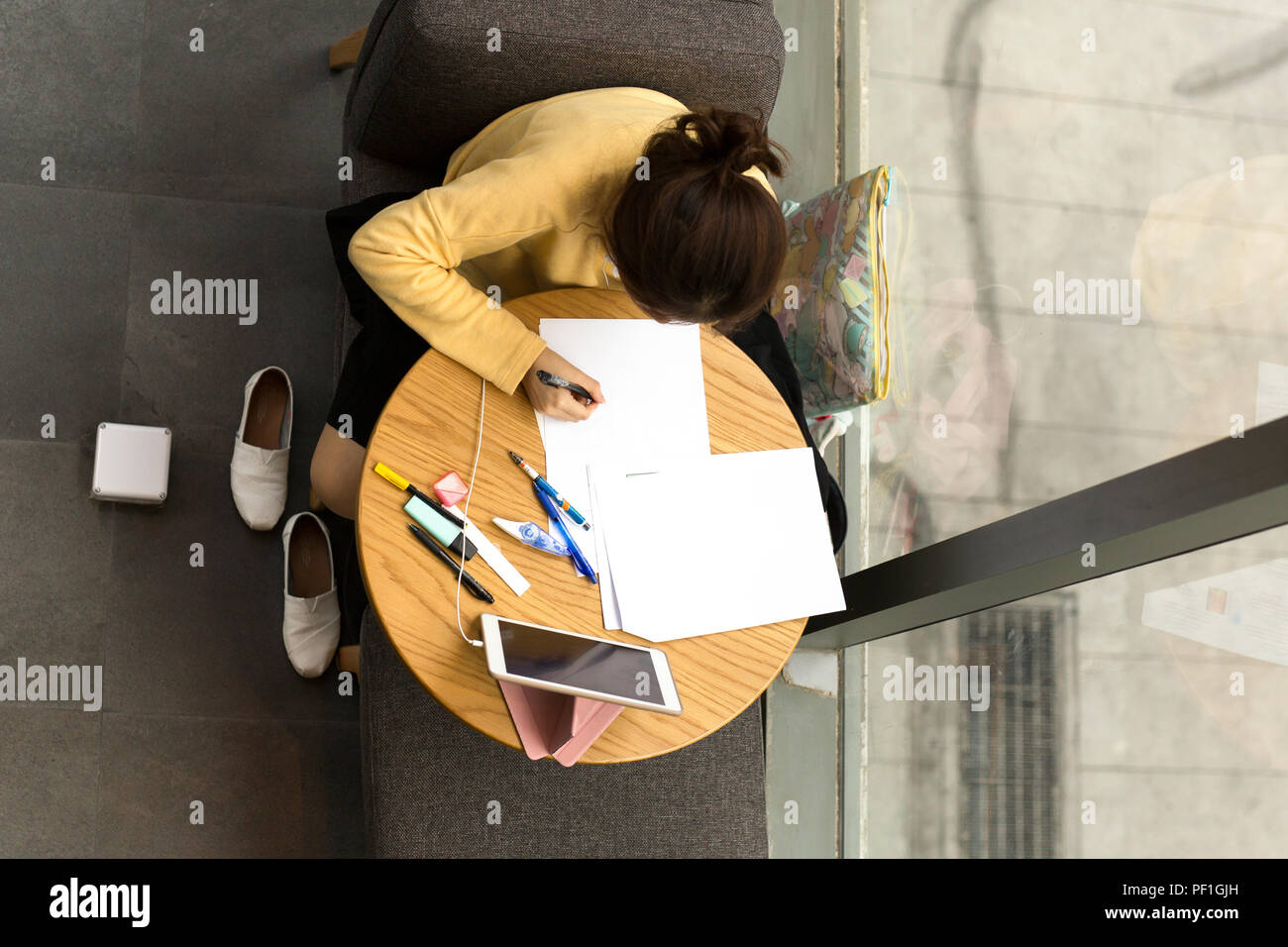 Top view student doing homework in coffee shop with notepad Stock Photo ...