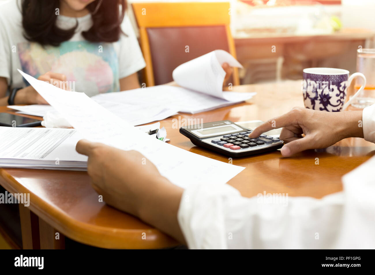 Businessman hand using calculator calculate hi-res stock photography ...