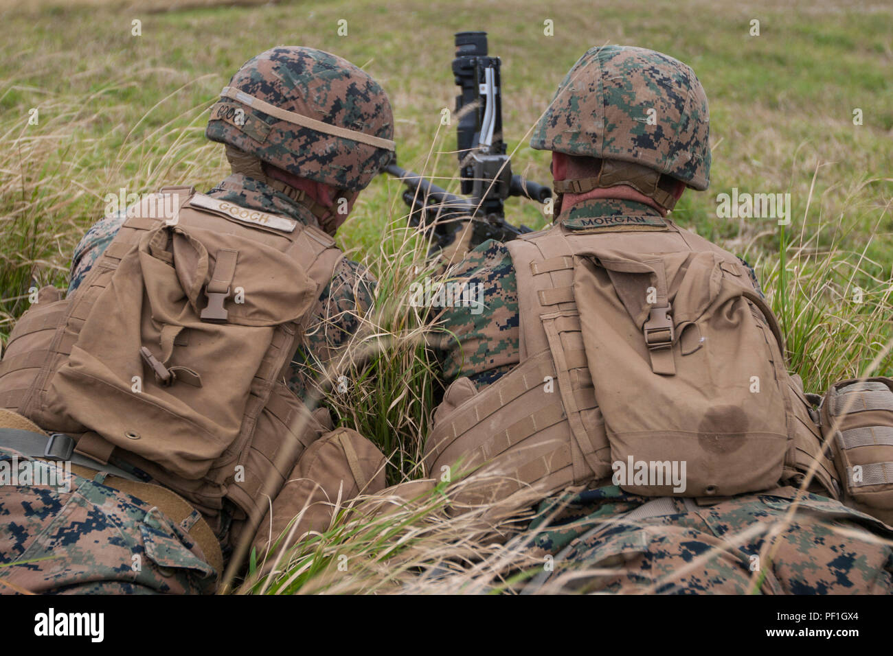 Cpl. Garret Gooch, left, and Lance Cpl. Taylor Morgan reload their ...