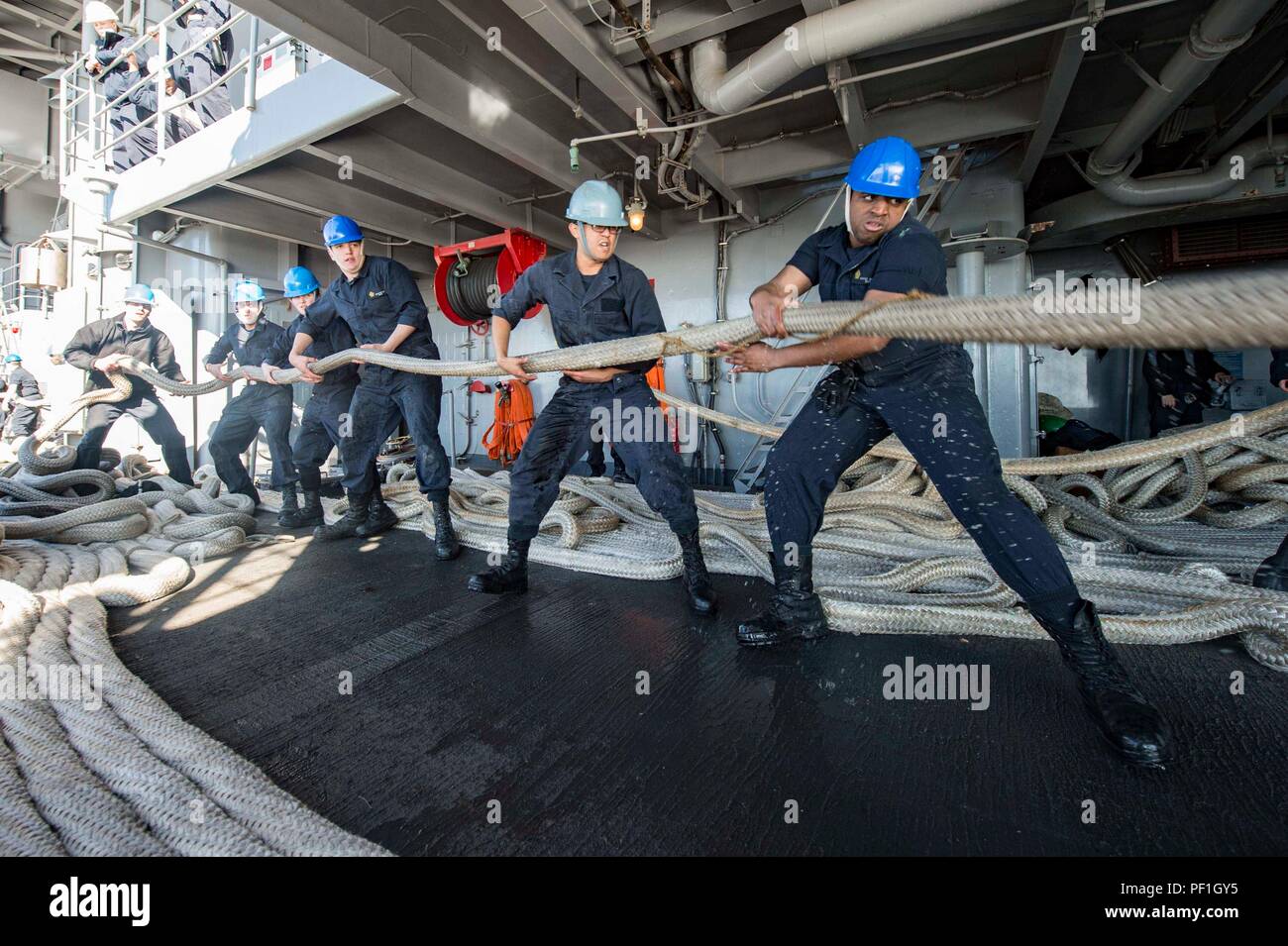 160229-N-KK394-140 ATLANTIC OCEAN (Feb. 29, 2016) Sailors pull in a mooring line during a sea ...