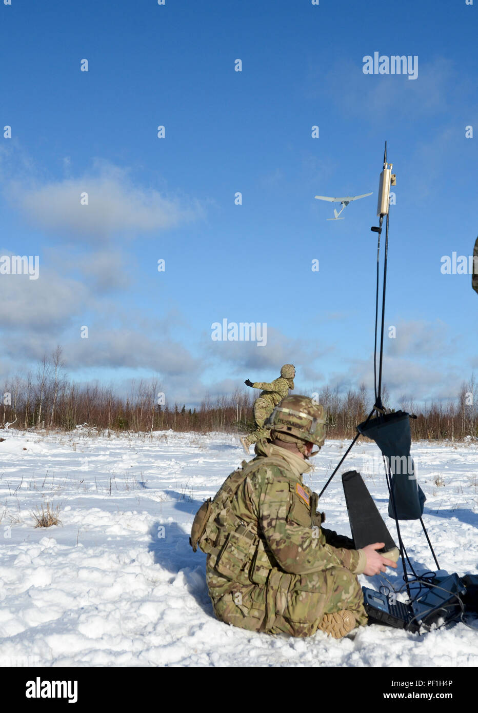 Spc. Thomas Nitcher (background), an Iron Troop infantryman with 3rd ...