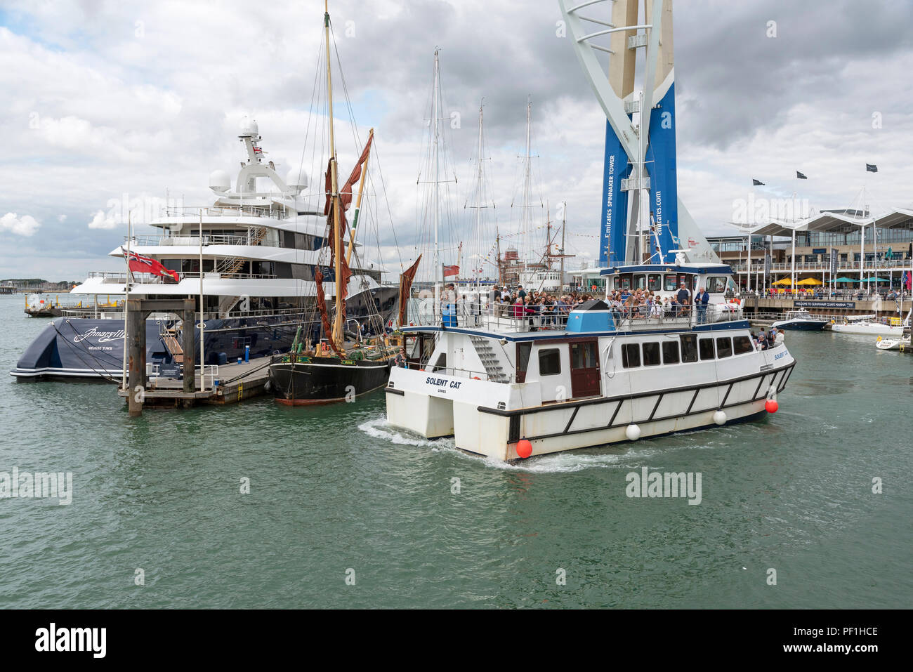 Super yacht Amaryllis and Alice a Thames sailing barge on the quay at ...