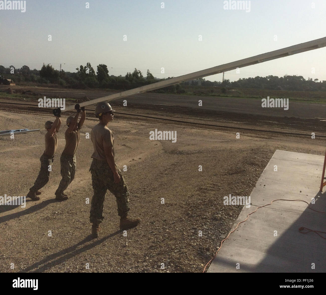 Civil engineers from 126th Air Refueling Wing work along side members ...