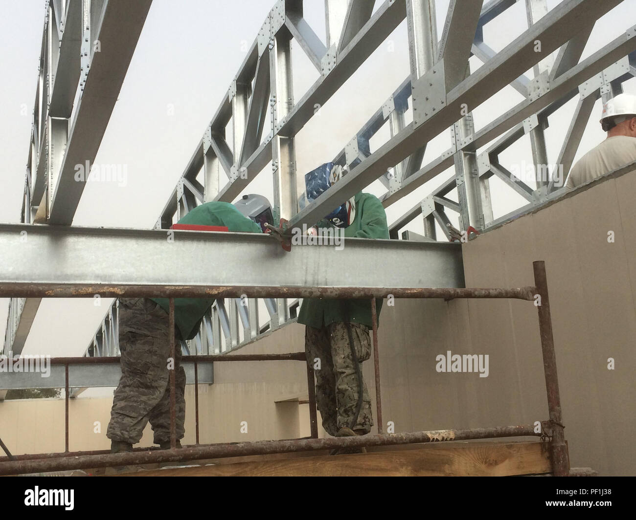 Civil engineers from 126th Air Refueling Wing work along side members ...