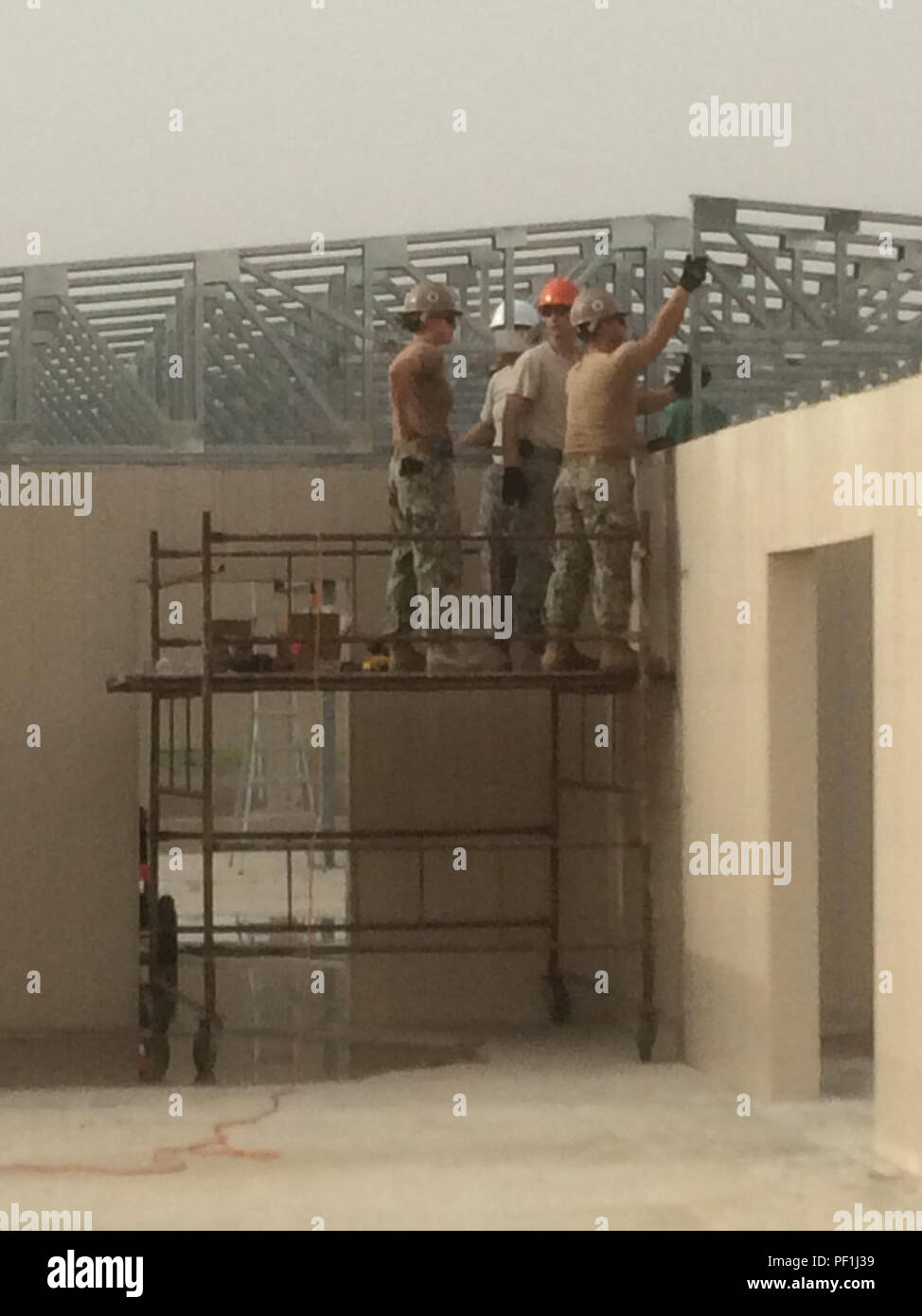 Civil engineers from 126th Air Refueling Wing work along side members ...