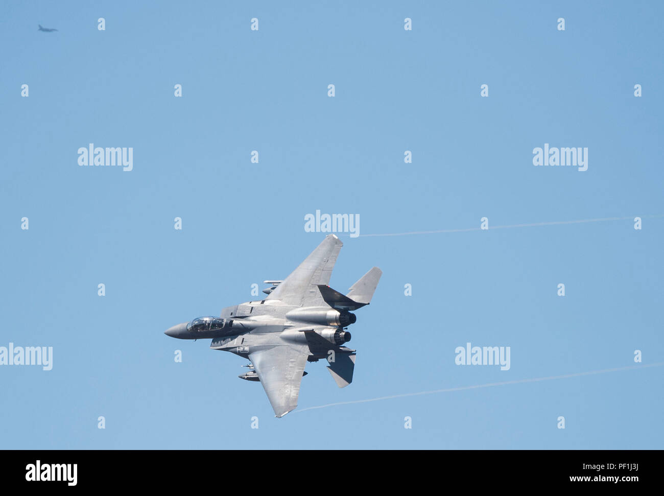 An F-15E Strike Eagle multirole fighter conducts aerial maneuvers over ...