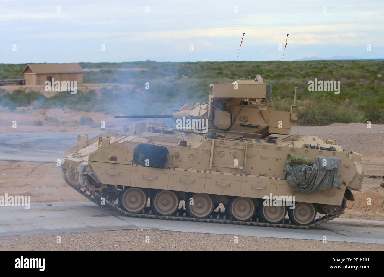 The M3A3 Bradley Fighting Vehicle engaging targets with the M242 25mm ...