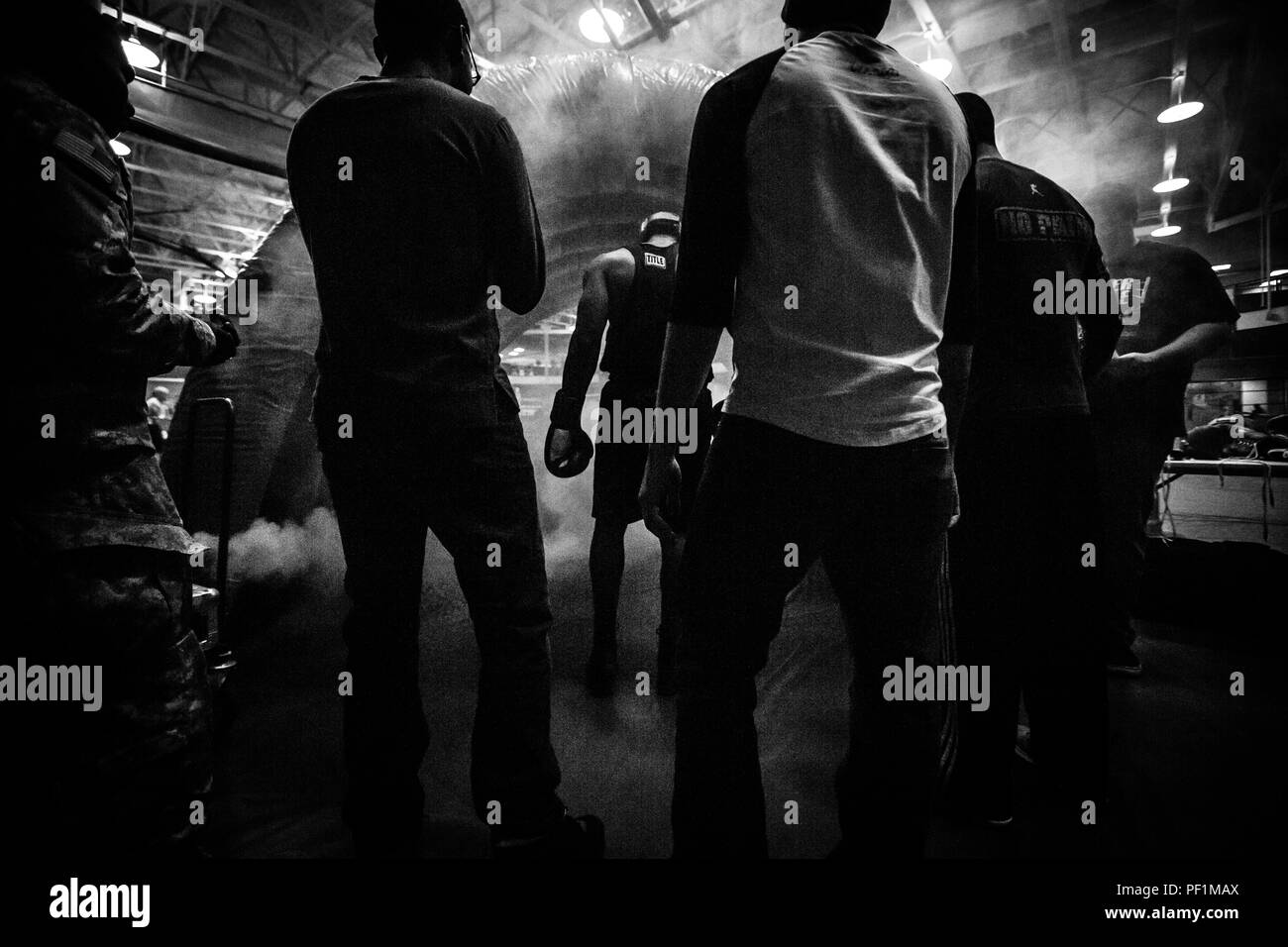 A boxer prepares to enter the ring during a boxing tournament at Fort ...