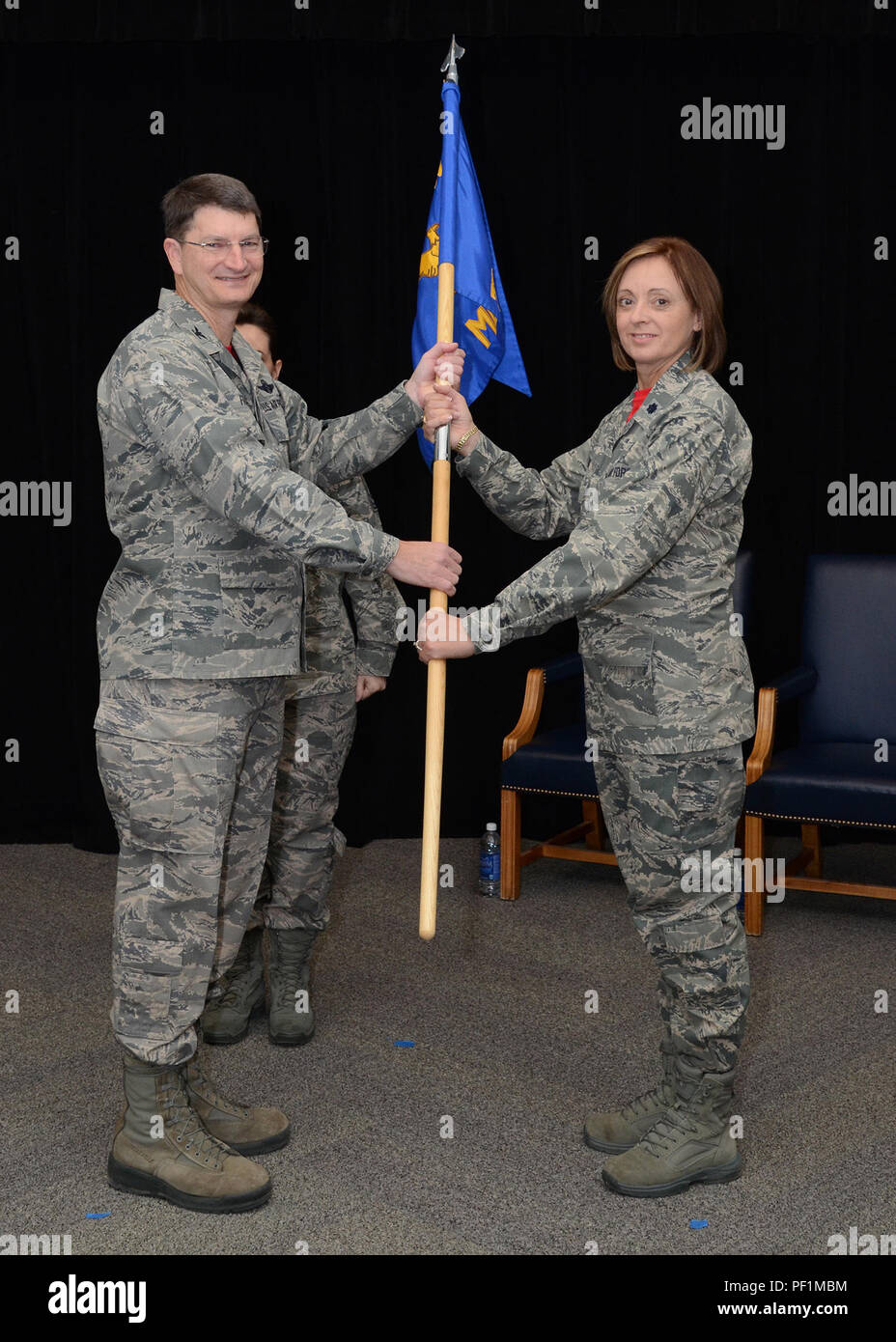 Lt. Col. Patti Fries receives the 131st Medical Group guidon from Col ...