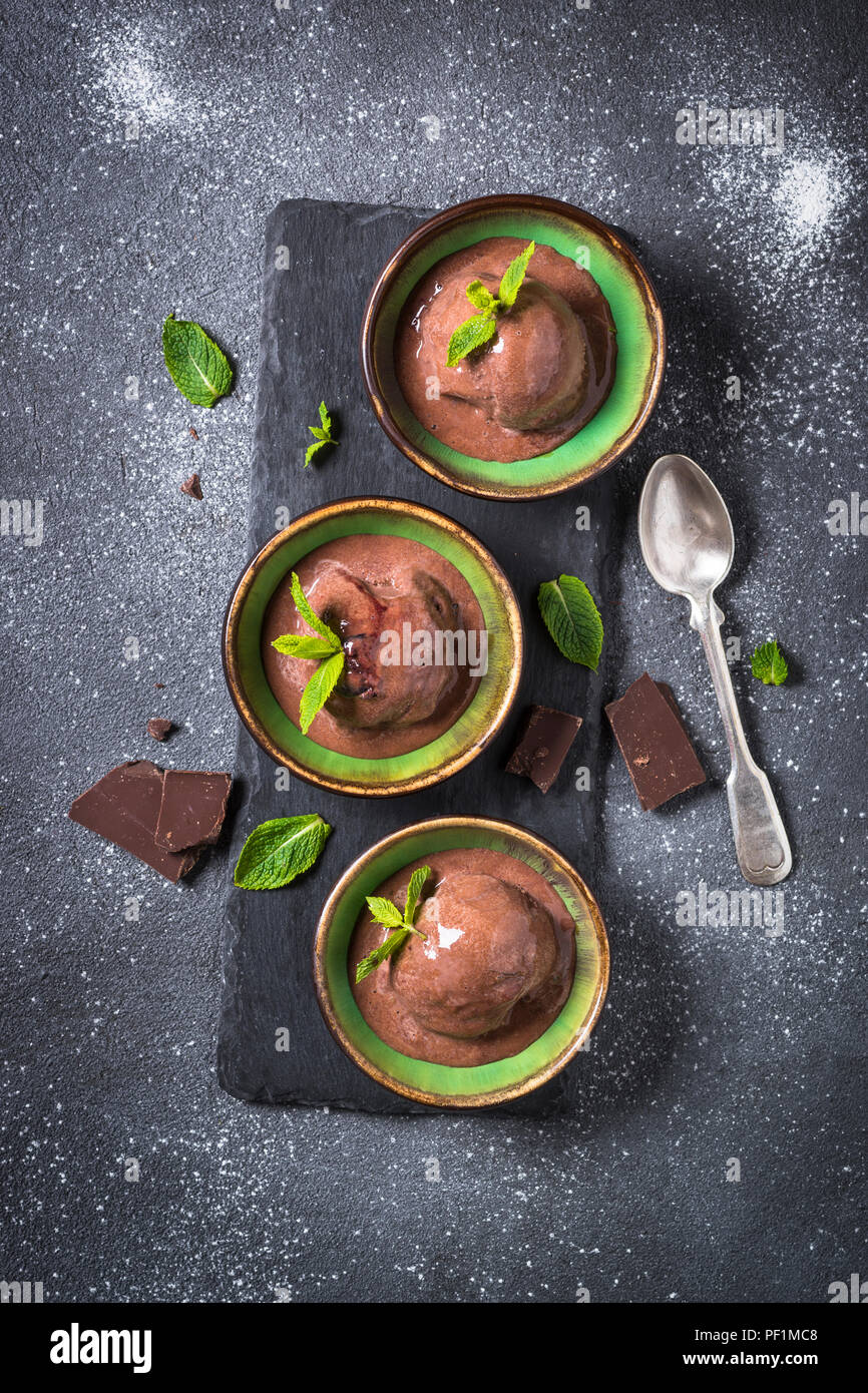 Chocolate ice cream top view on black Stock Photo - Alamy