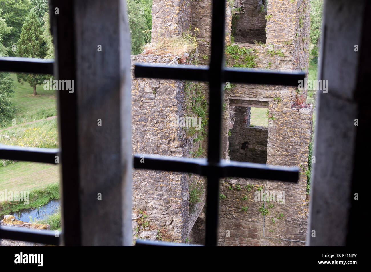 Castle window looking through Iron window Stock Photo - Alamy