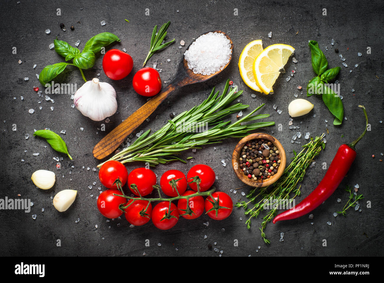 Food cooking background on black top view Stock Photo - Alamy