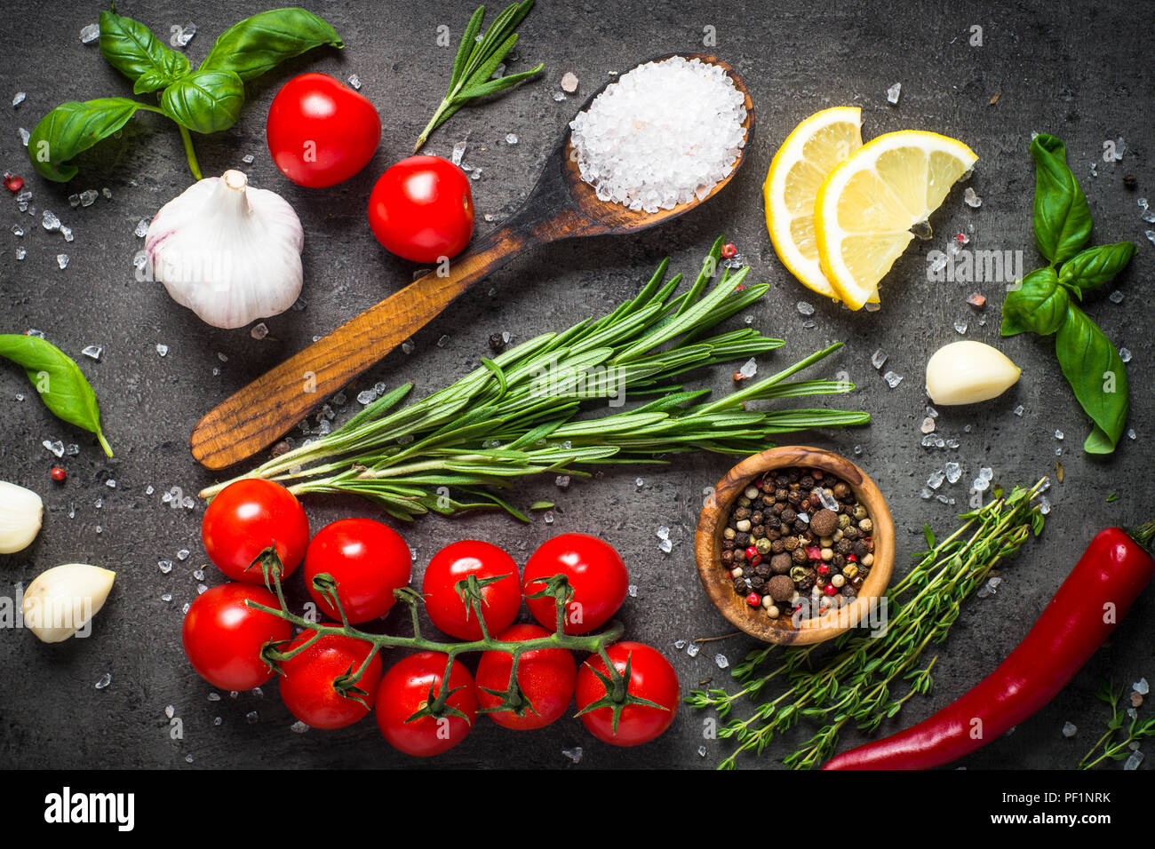 Food cooking background on black top view Stock Photo - Alamy
