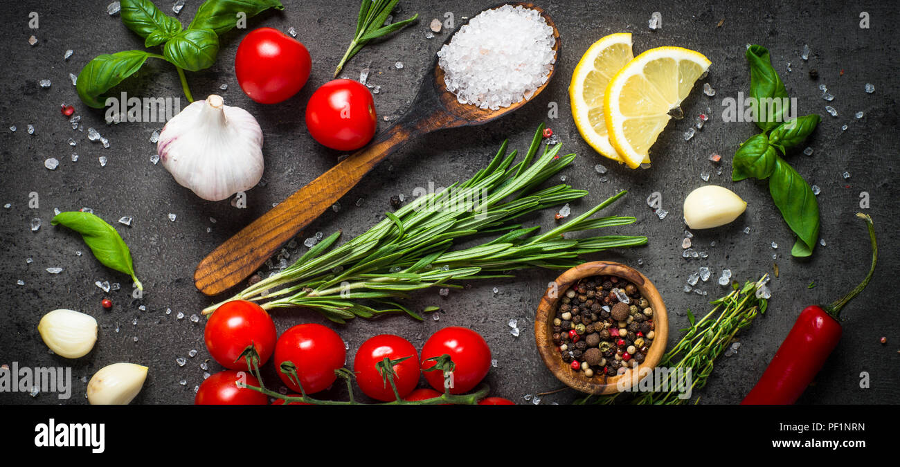Food cooking background on black top view Stock Photo - Alamy