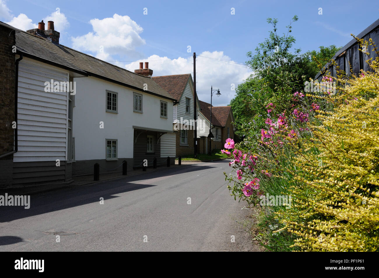Building with weatherboarding and overhanging upper storey ...