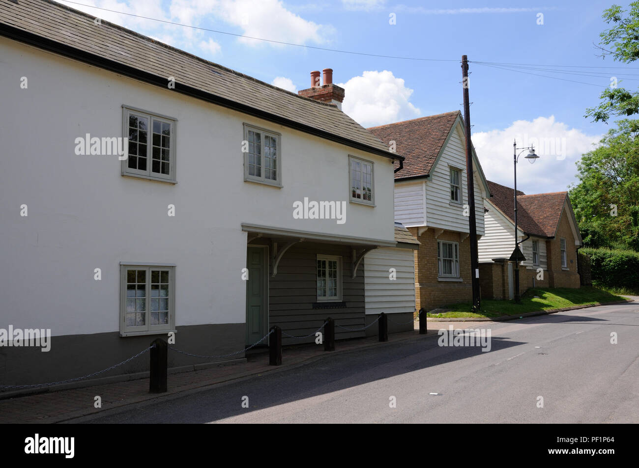 Building with weatherboarding and overhanging upper storey ...