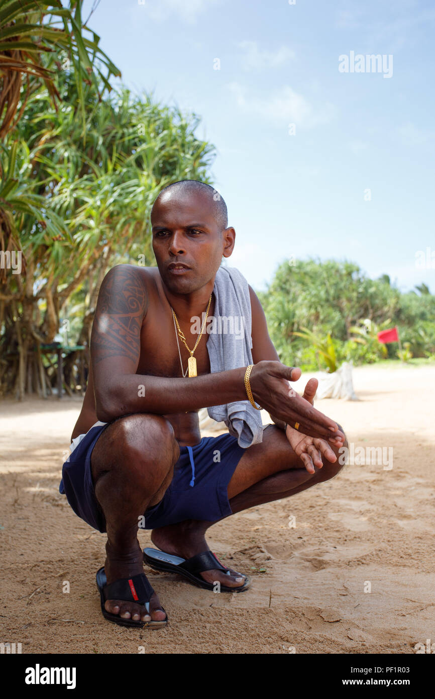 Local resident of Sri Lanka on the beach Stock Photo - Alamy