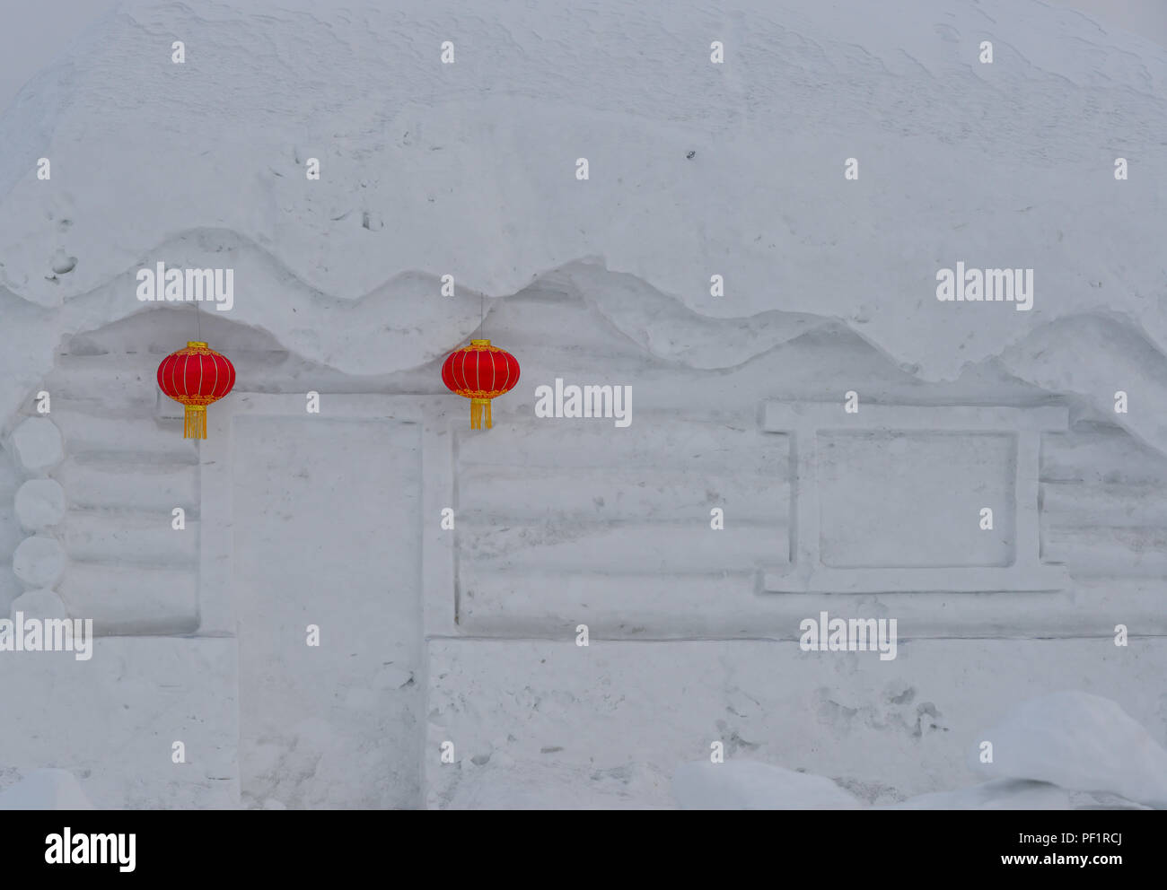 Traditional snow house with red lanterns at mountain village in ...