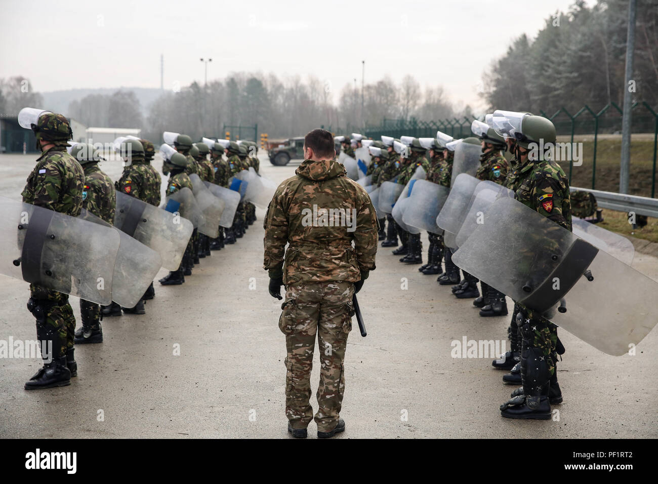 A Slovenian soldier of Slovenian Military Police, center, observes ...
