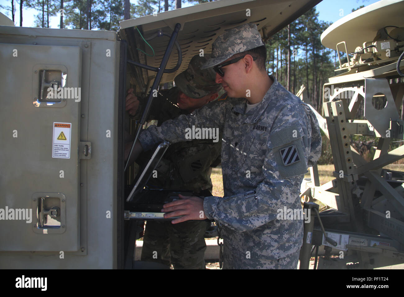 Sgt. Michael Remaly (rear), a Joint Network Node team leader, and Spc ...