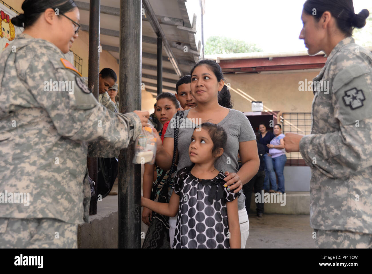 U.S. Army Sgt. Mary King, preventative medicine technician, gives a ...