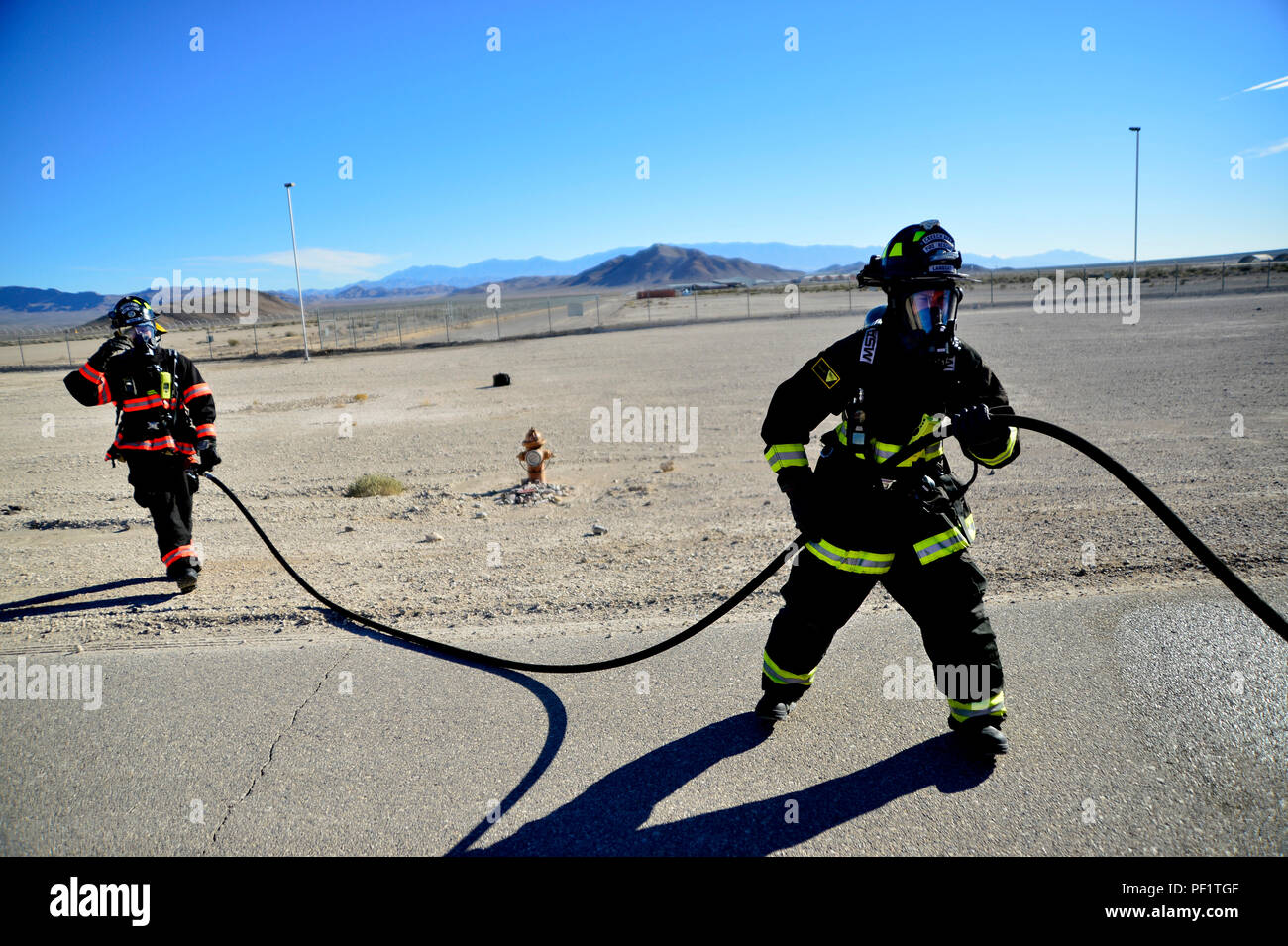 Carl Lambert, front, and Kevin Searle, 99th Civil Engineering Squadron ...