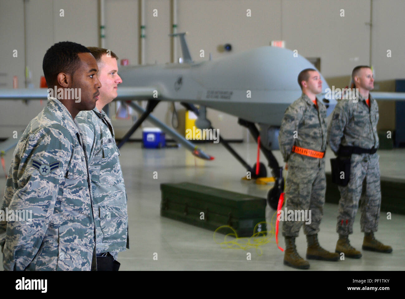 The Reaper Aircraft Maintenance Unit weapons load crew team, left, and ...