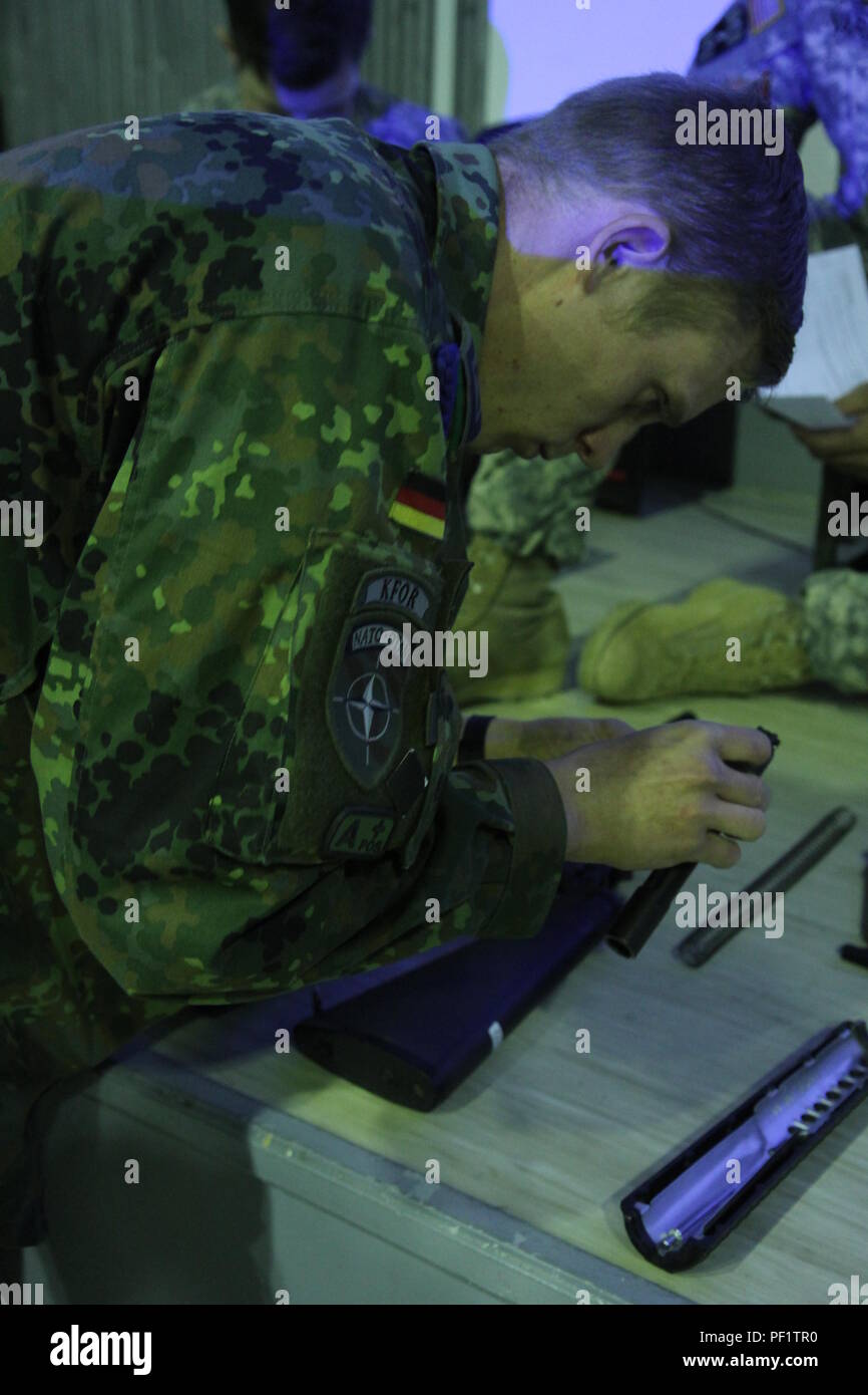 A German soldier assigned to the Multinational Battle Group-East ...