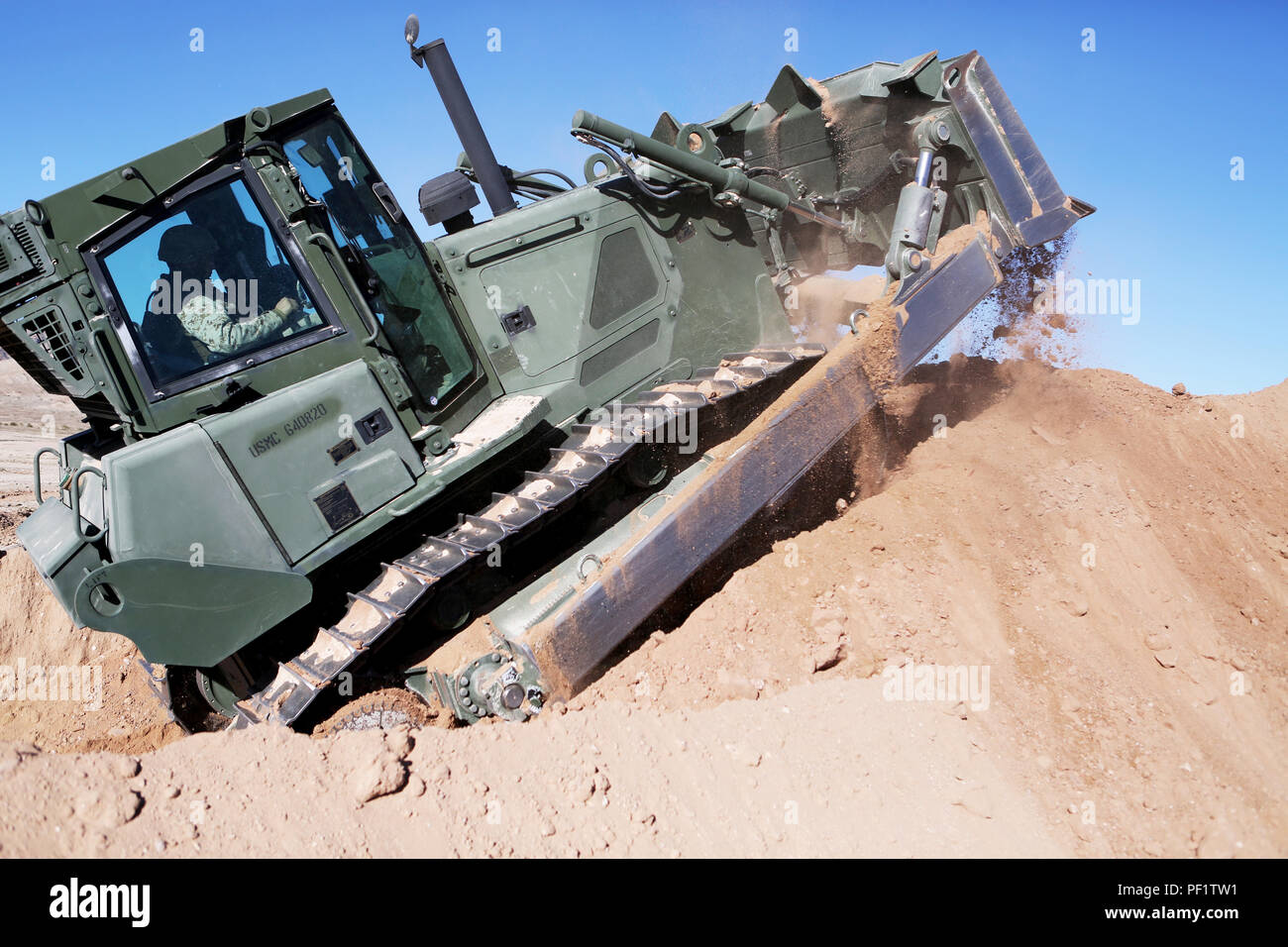 Lance Cpl. Aaron Copley, a heavy equipment operator with Headquarters ...