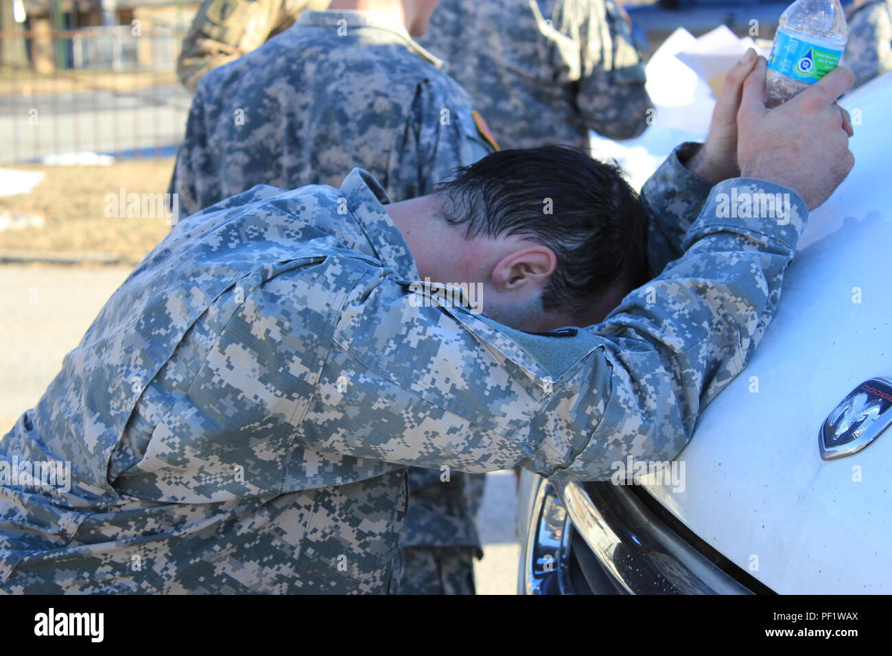 Maryland Guardsman Capt. Michael Walker rests after completing the ...