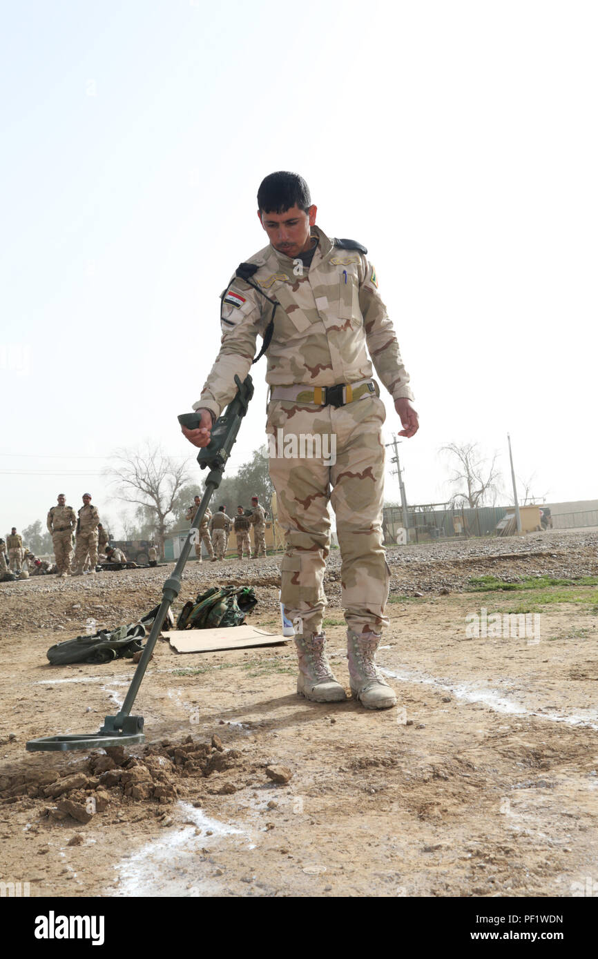 An Iraqi soldier attending the Junior Leaders Course (JLC) uses a ...