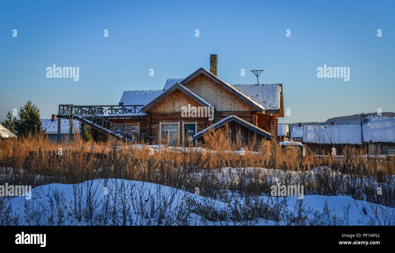 Rural house covered by snow at mountain village in Northernmost China ...