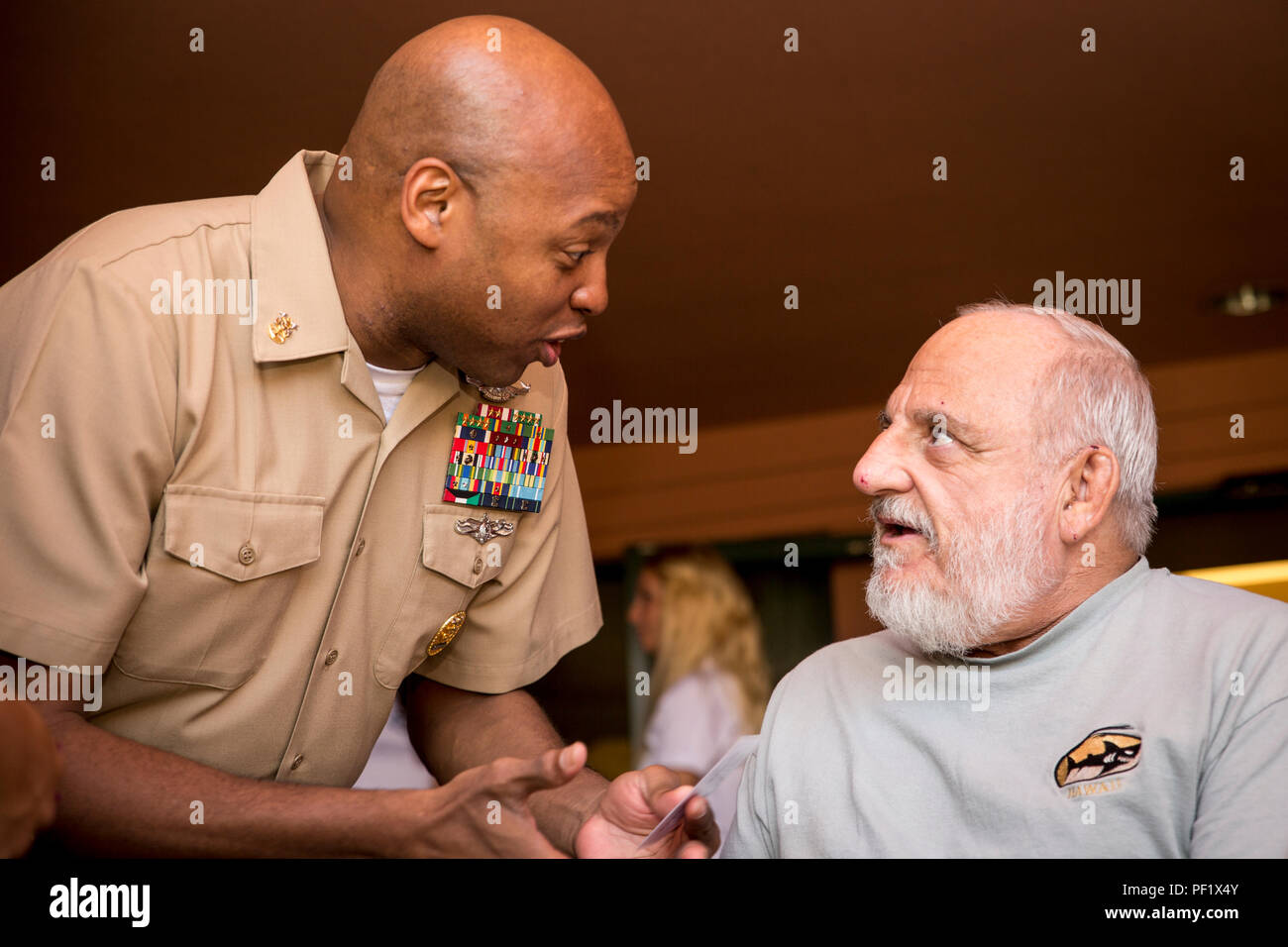 Retired Marine veteran Frank O. Comito (right) speaks with Master Chief ...