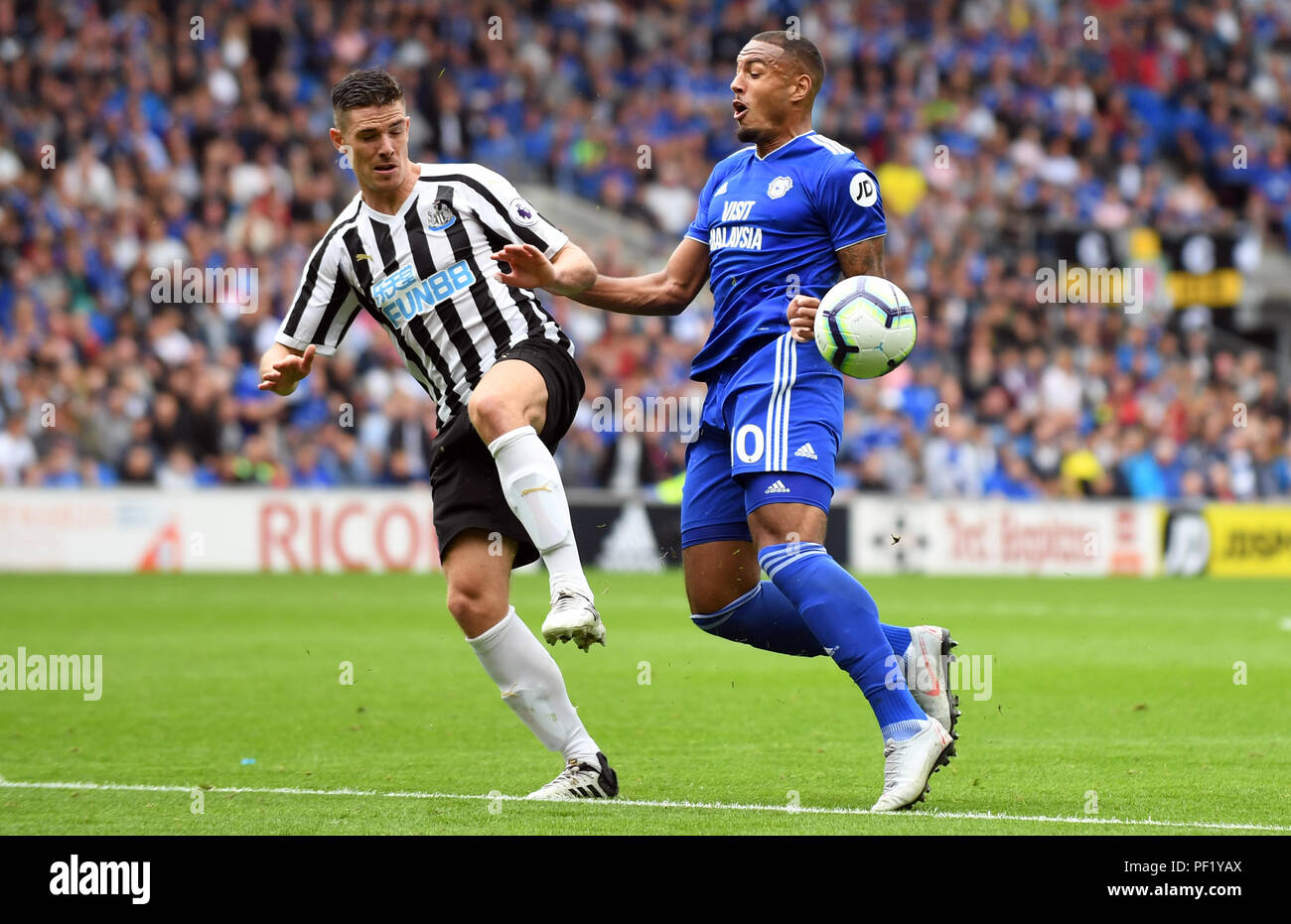 Newcastle United's Ciaran Clark (left) and Cardiff City's Kenneth ...