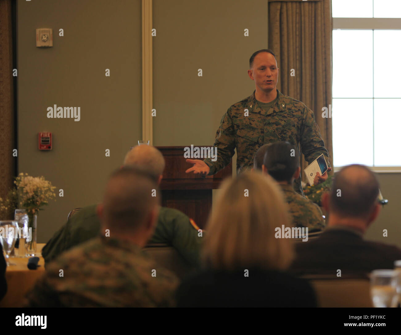 Colonel Chris Pappas III speaks to volunteers and service members ...