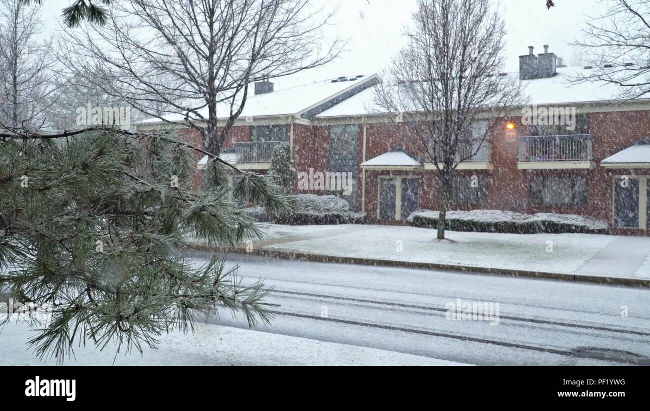 Establishing shot of a residential area during a massive winter snow ...