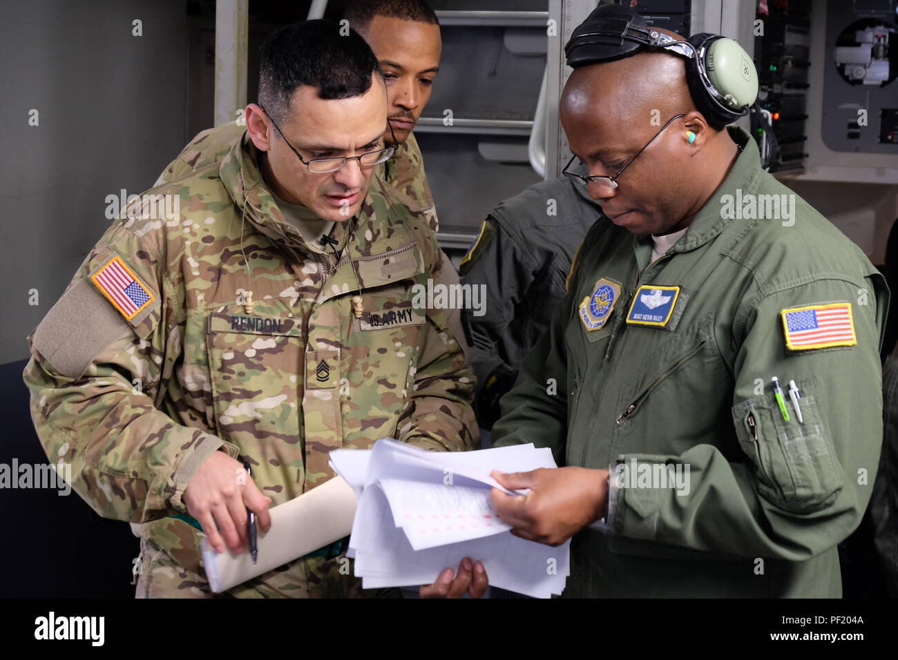U.S. Army Reserve Sgt. 1st Class Joaquin Rendon, left, the ...