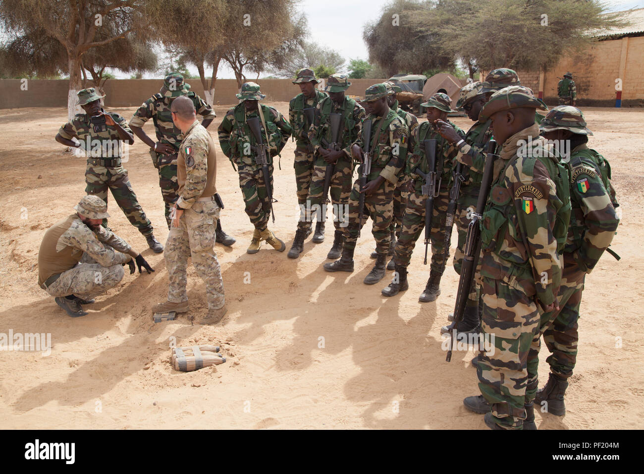 An Italian Soldier explains counter-IED measures to Senegalese Soldiers ...