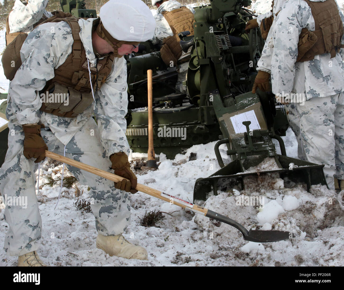 Cpl. Stanley Ptak, section chief for Combined Arms Company, buries a ...