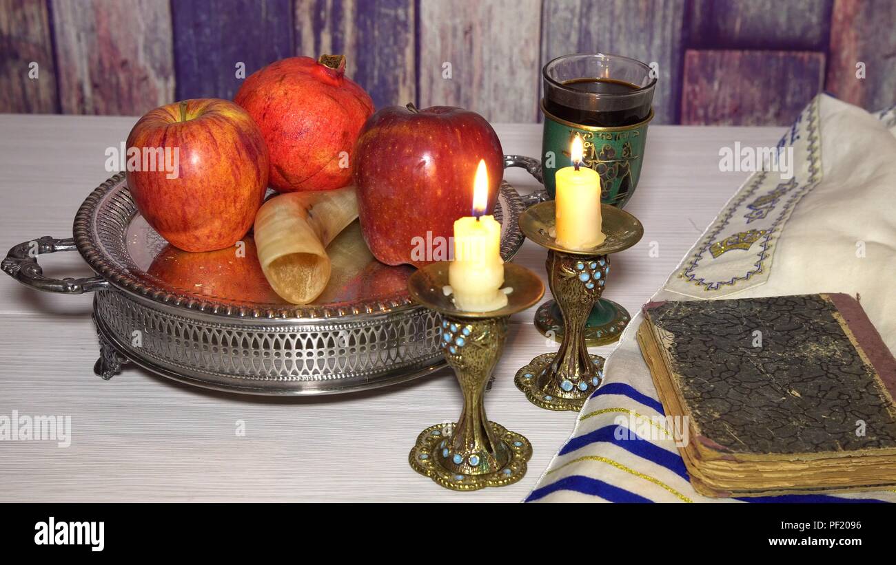Jewish holiday shofar, torah book, honey, apple and pomegranate rosh ...