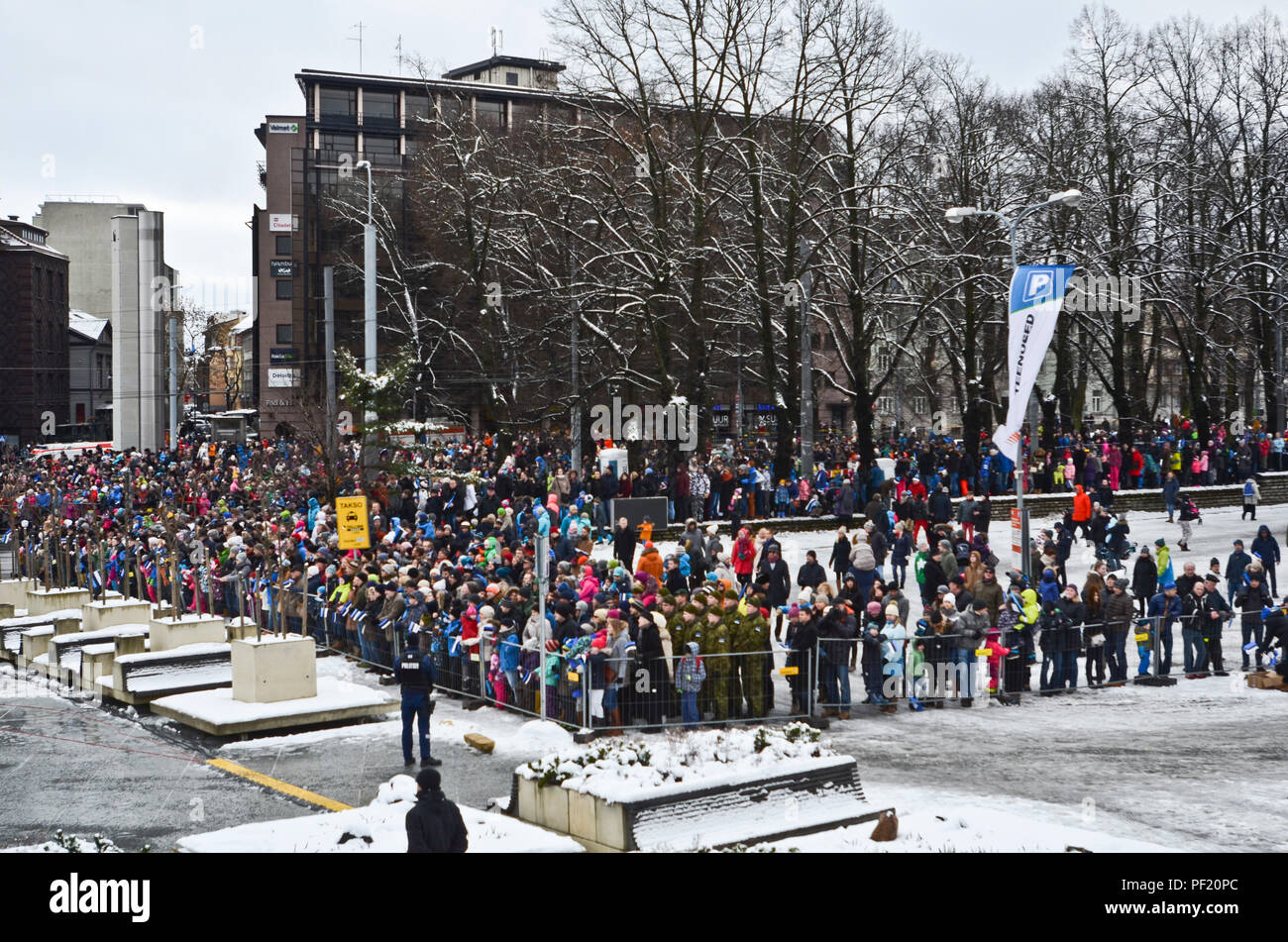 Thousands flood to the hillside, sidewalks, windows and roof tops ...