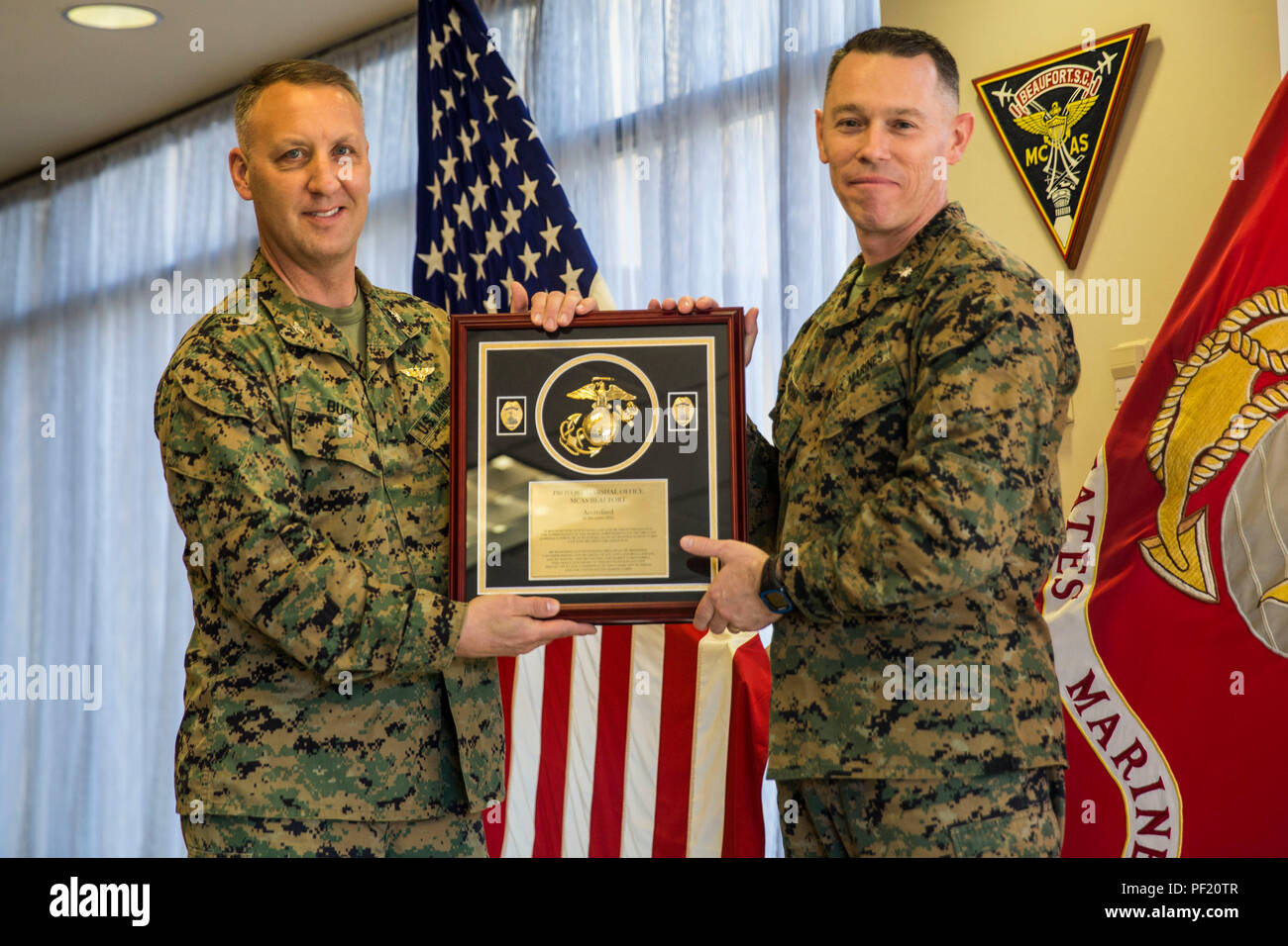 Col. Peter Buck, Left, receives a plaque of recognition from Lt. Col ...