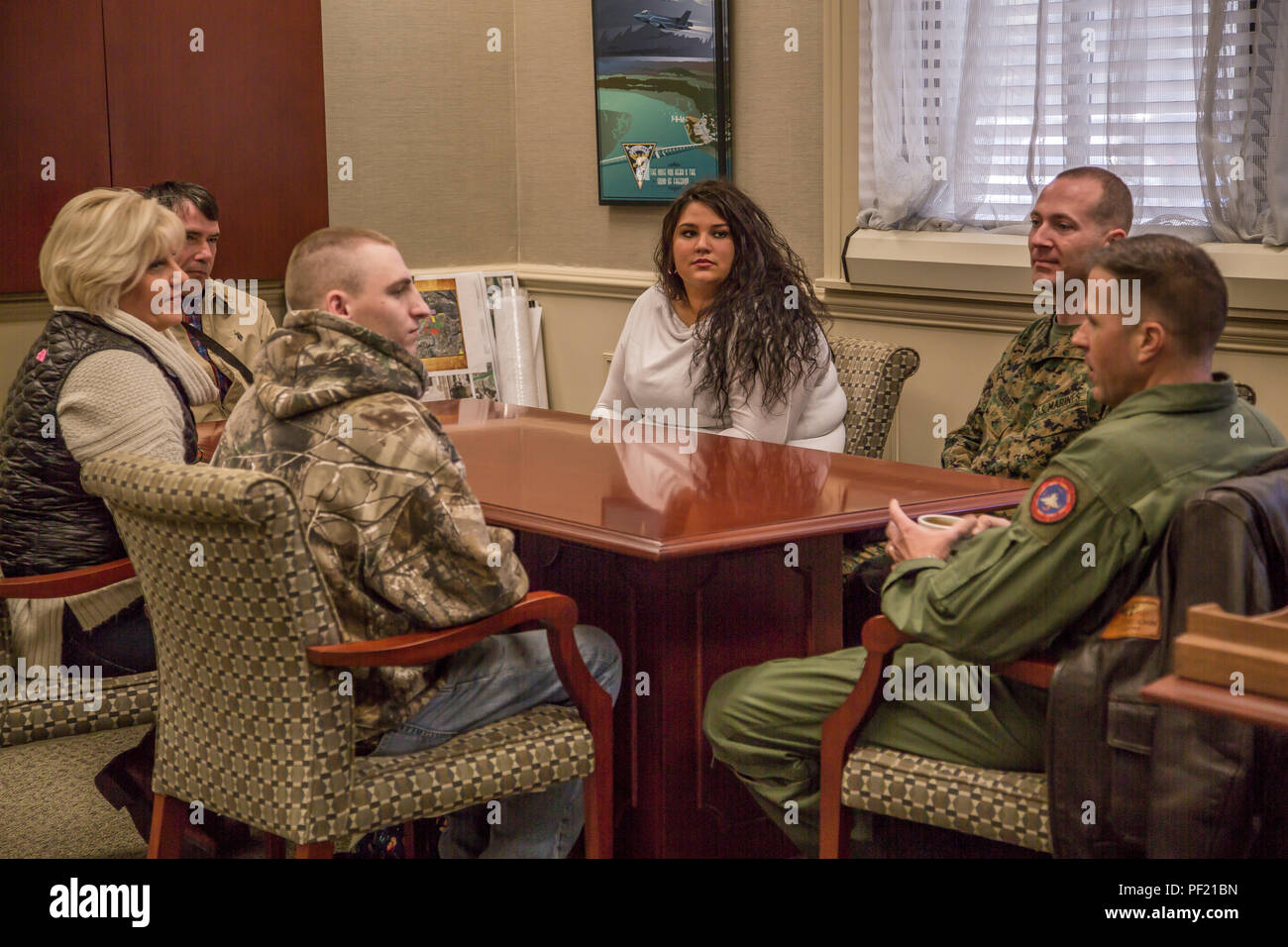 Timothy Rhodes and his family speak with Lt. Col. Sean D. Henrickson ...