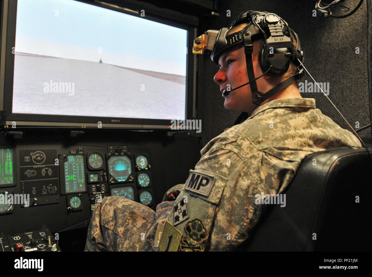 Joshua Hetherington sits in the cockpit of a UH-60 Black Hawk ...