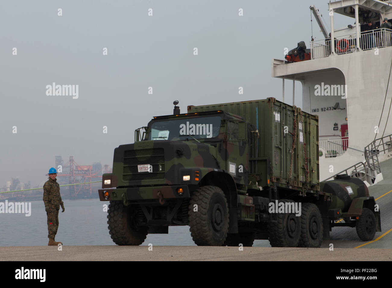U.S. Marines with the Combat Logistics Regiment 35, off load from High Speed Vessel 1 in support ...