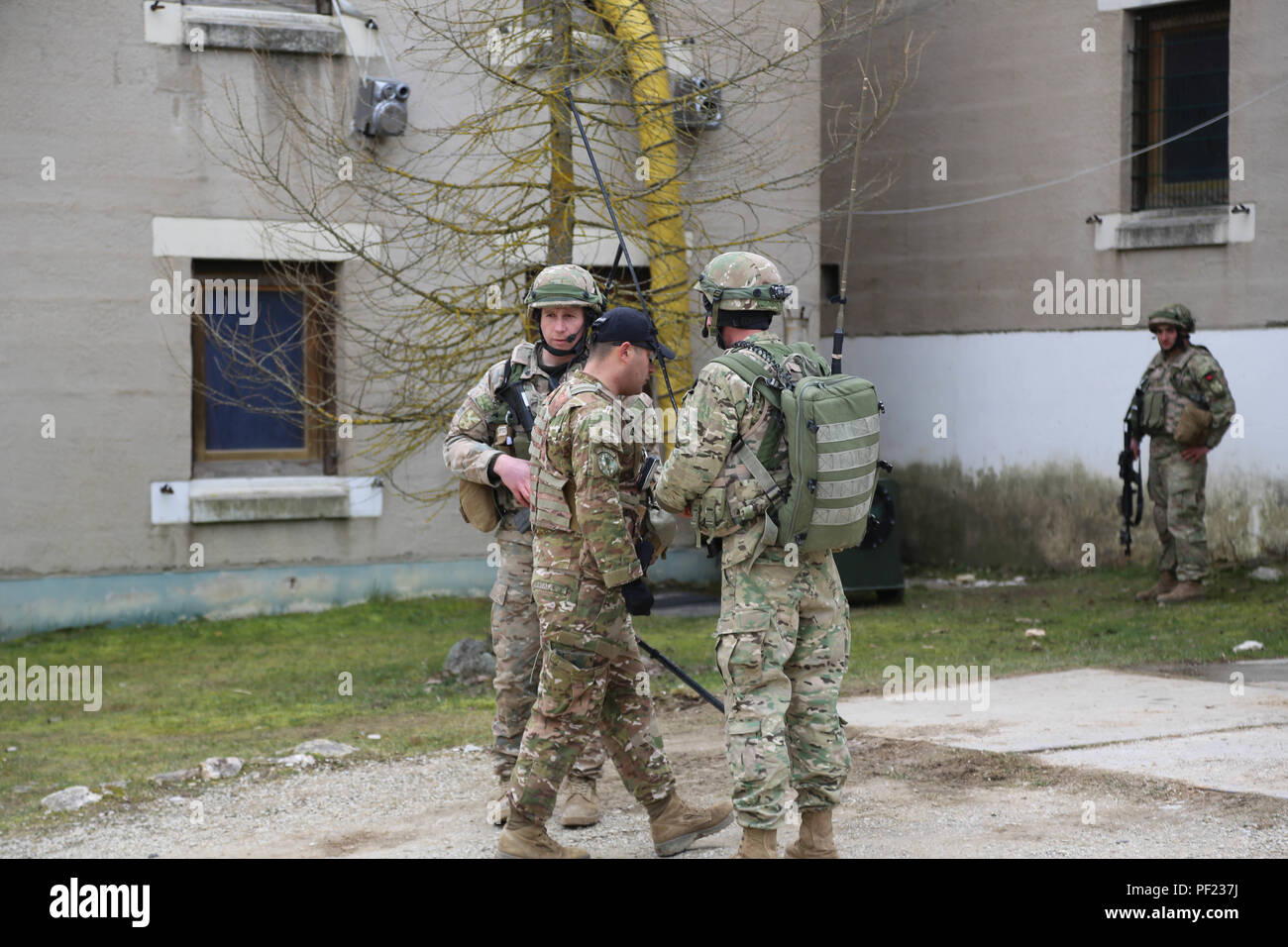 A Georgian observer coach trainer, center, provides feedback to ...